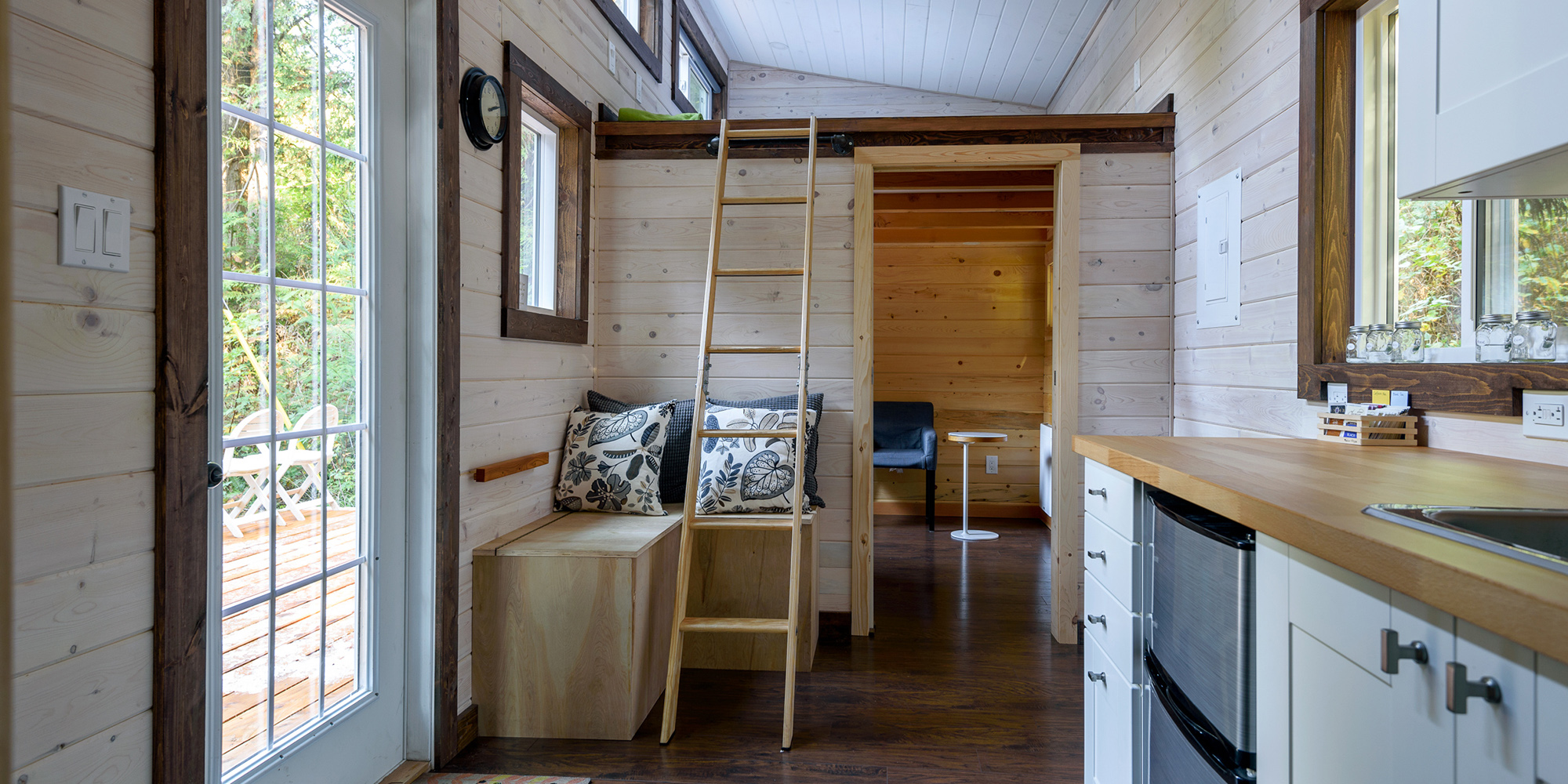 Interior design of a dining room and kitchen in a tiny rustic lo ...